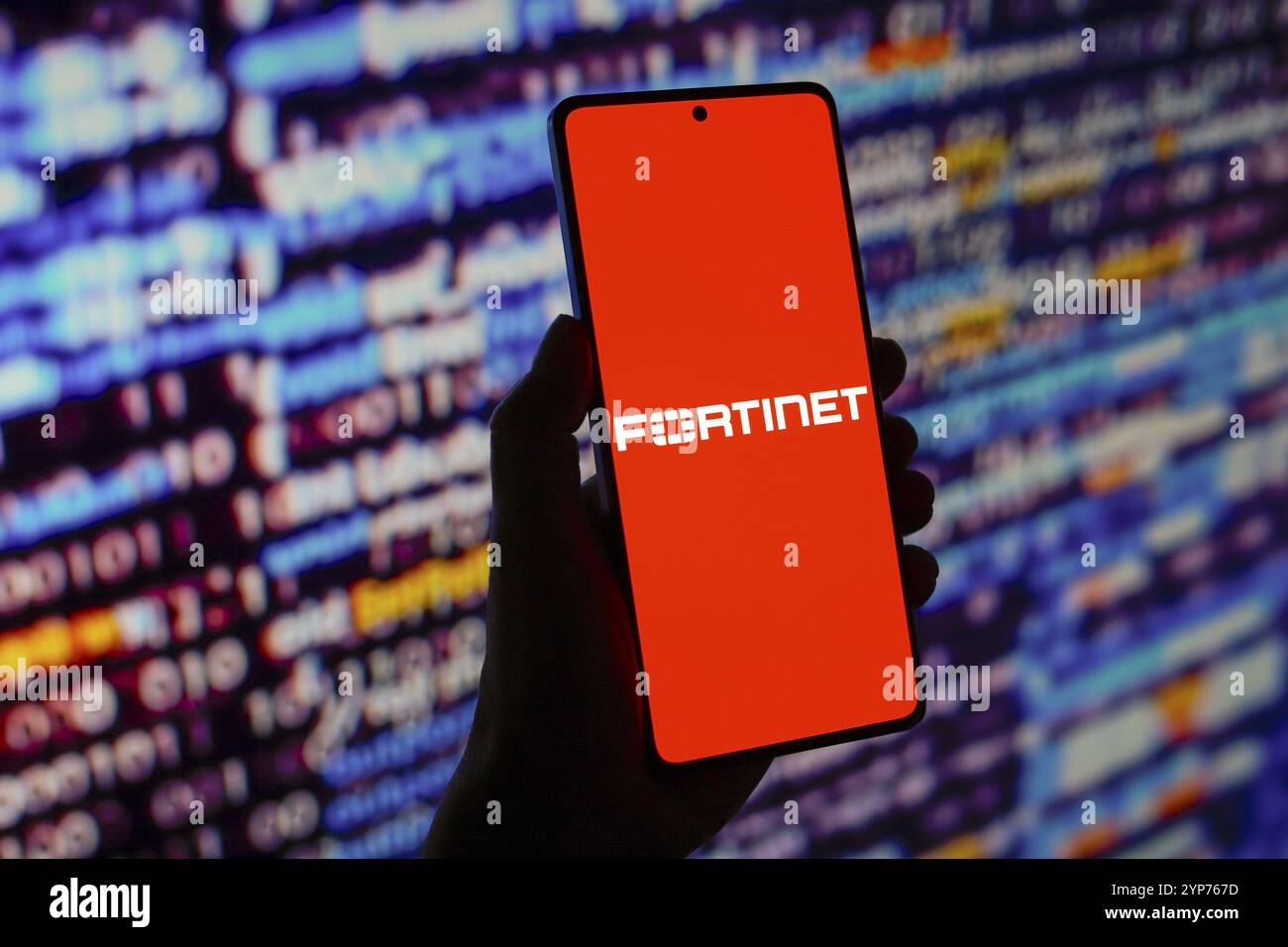 In this photo illustration, the Fortinet logo is displayed on a ...