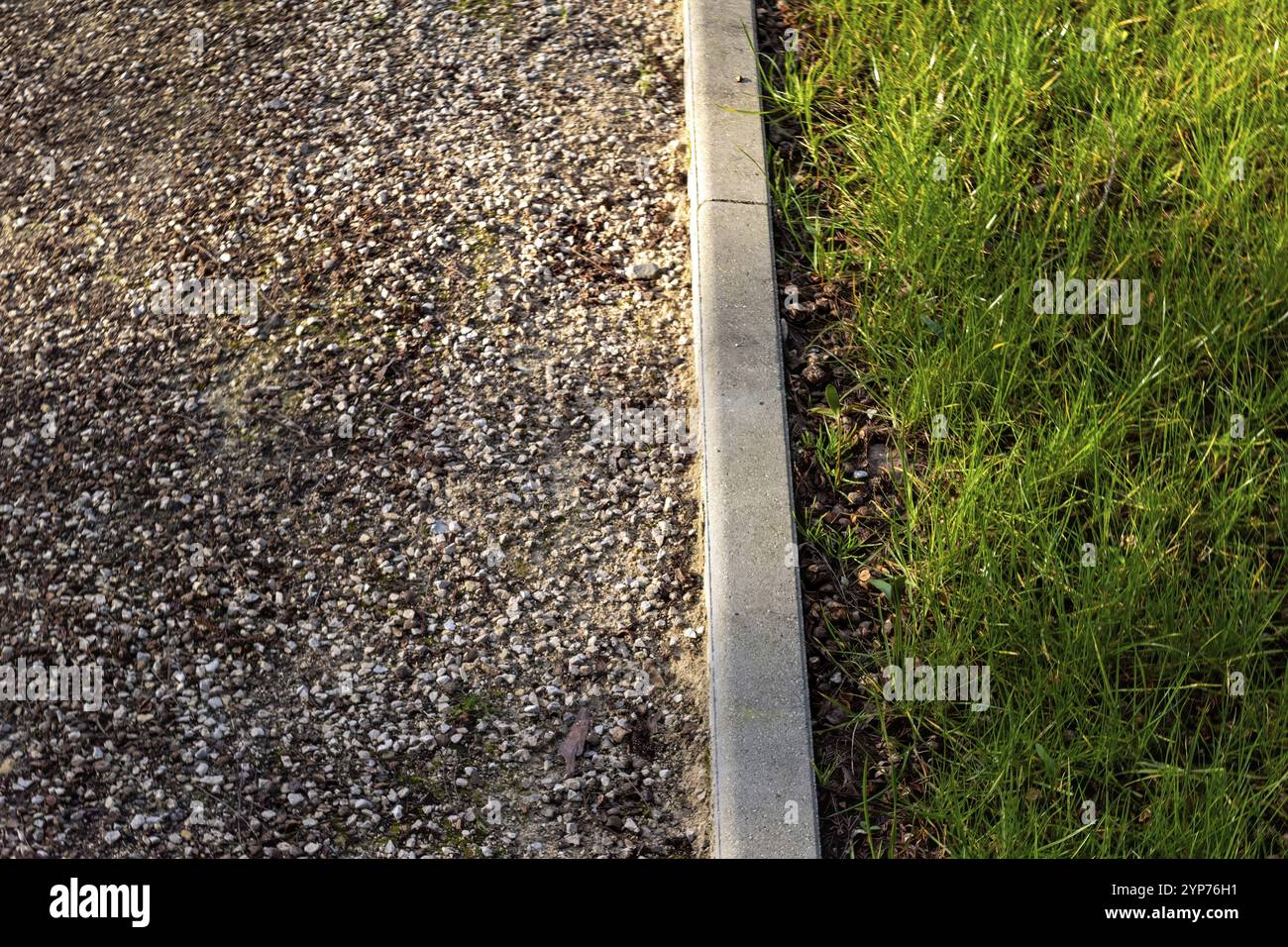 View from above Gravel path, curb, grass Stock Photo - Alamy