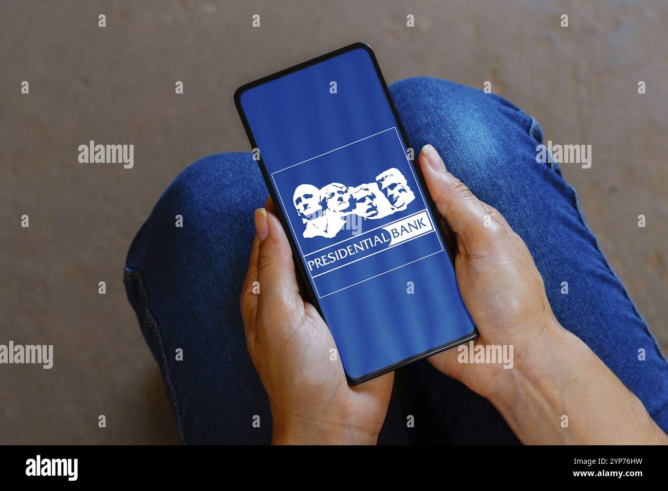 In this photo illustration, the Presidential Bank logo is displayed on ...