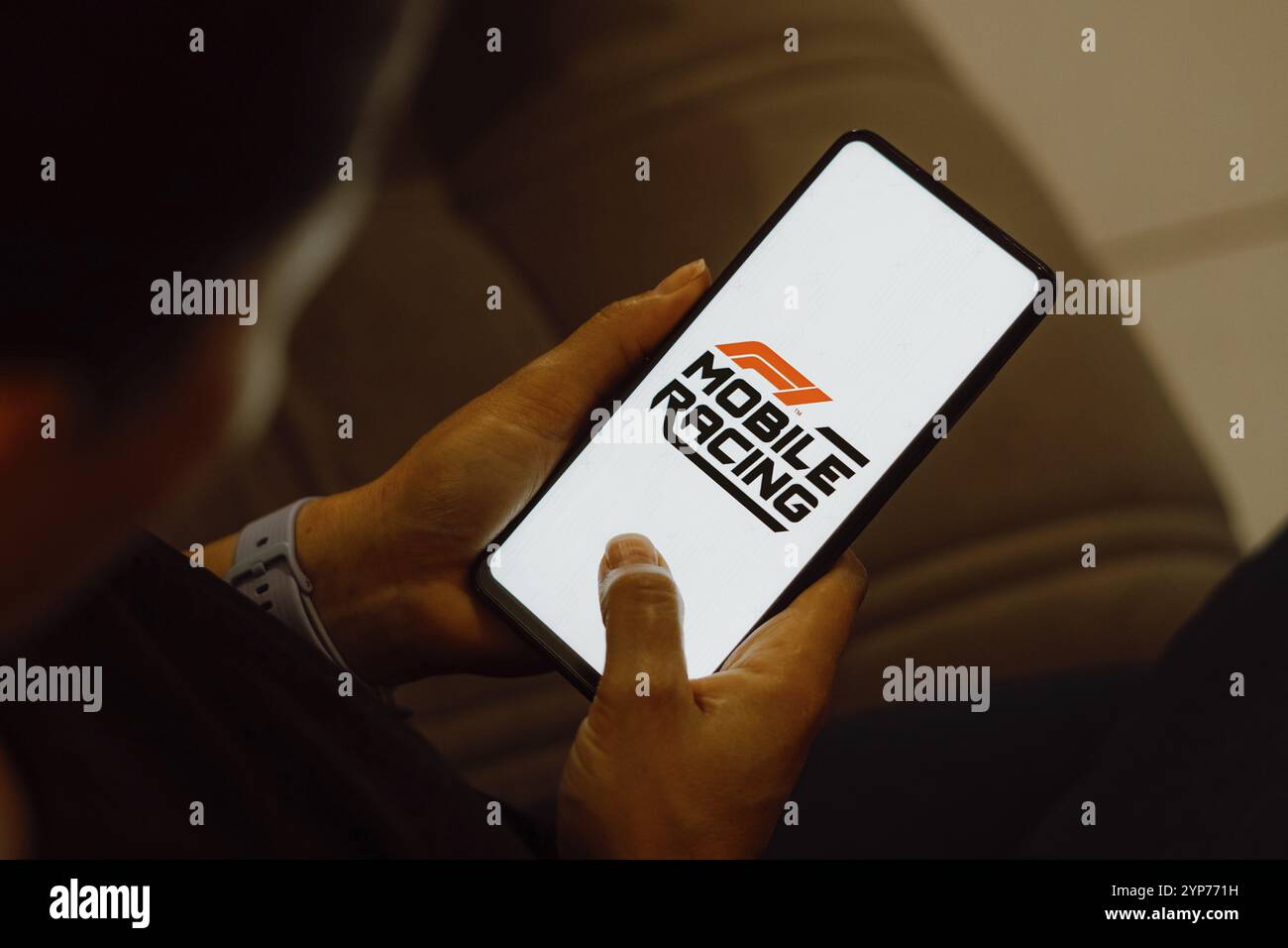 In this photo illustration, the F1 Mobile Racing logo is displayed on a ...