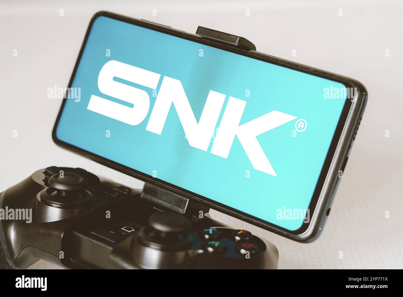 In this photo illustration, the SNK Corporation logo displayed on a ...