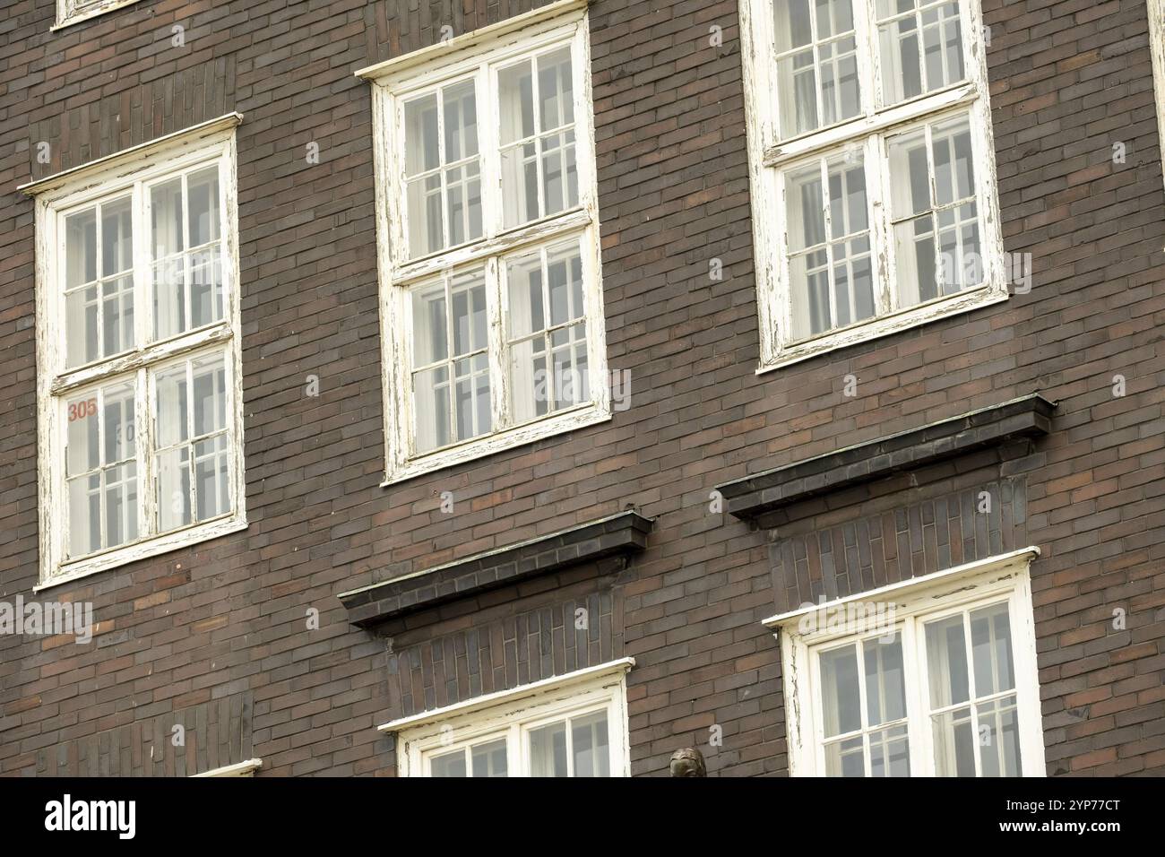 Old brick building with old double windows Stock Photo - Alamy