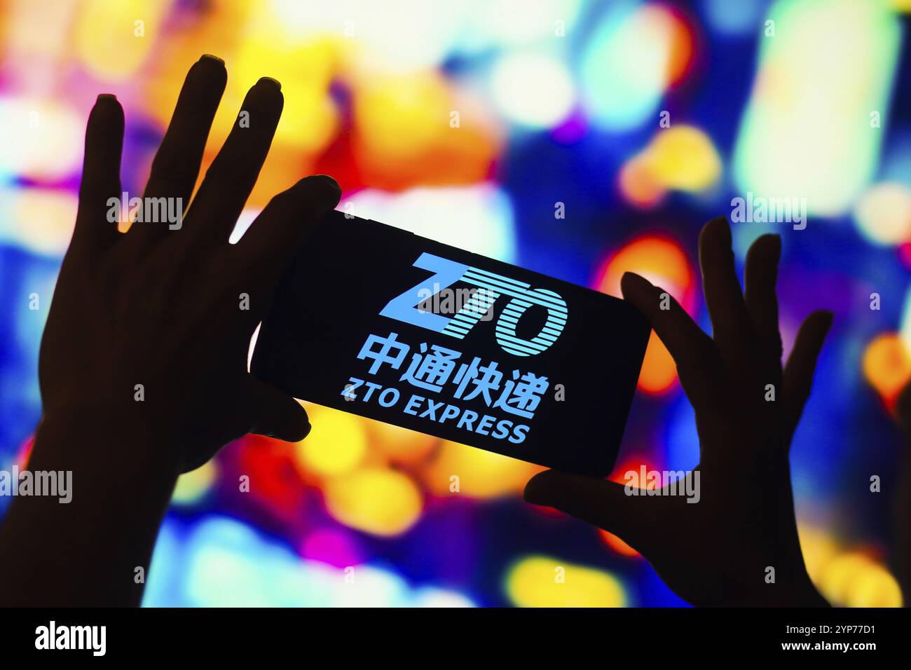 In this photo illustration, the ZTO Express logo is displayed on a ...