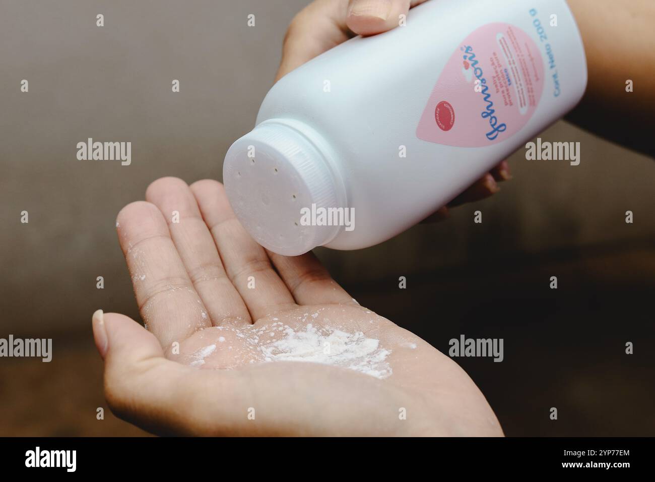 In this photo illustration, a person uses Johnson Johnson baby powder ...
