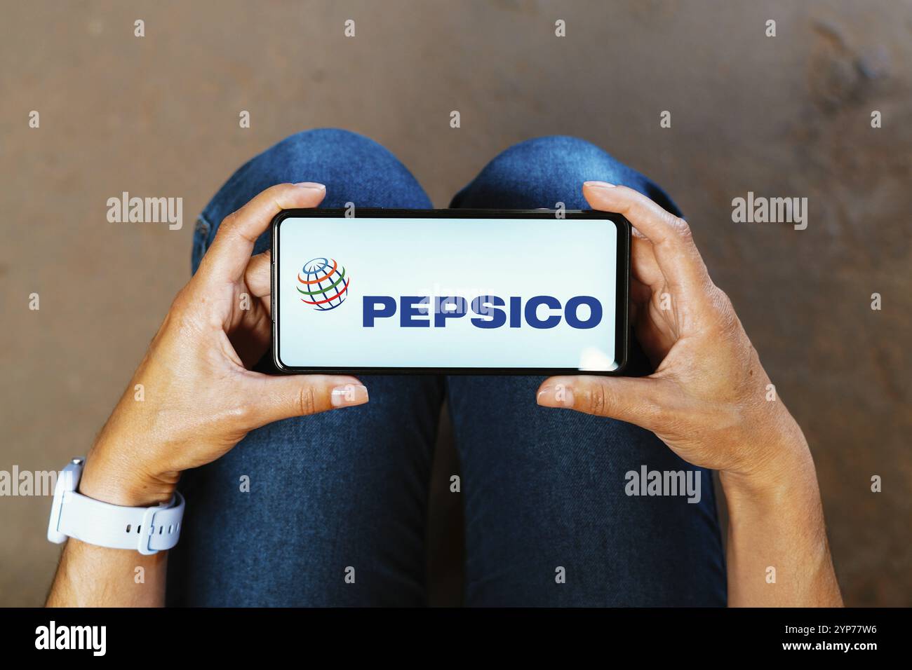 In this photo illustration, the PepsiCo logo is displayed on a ...