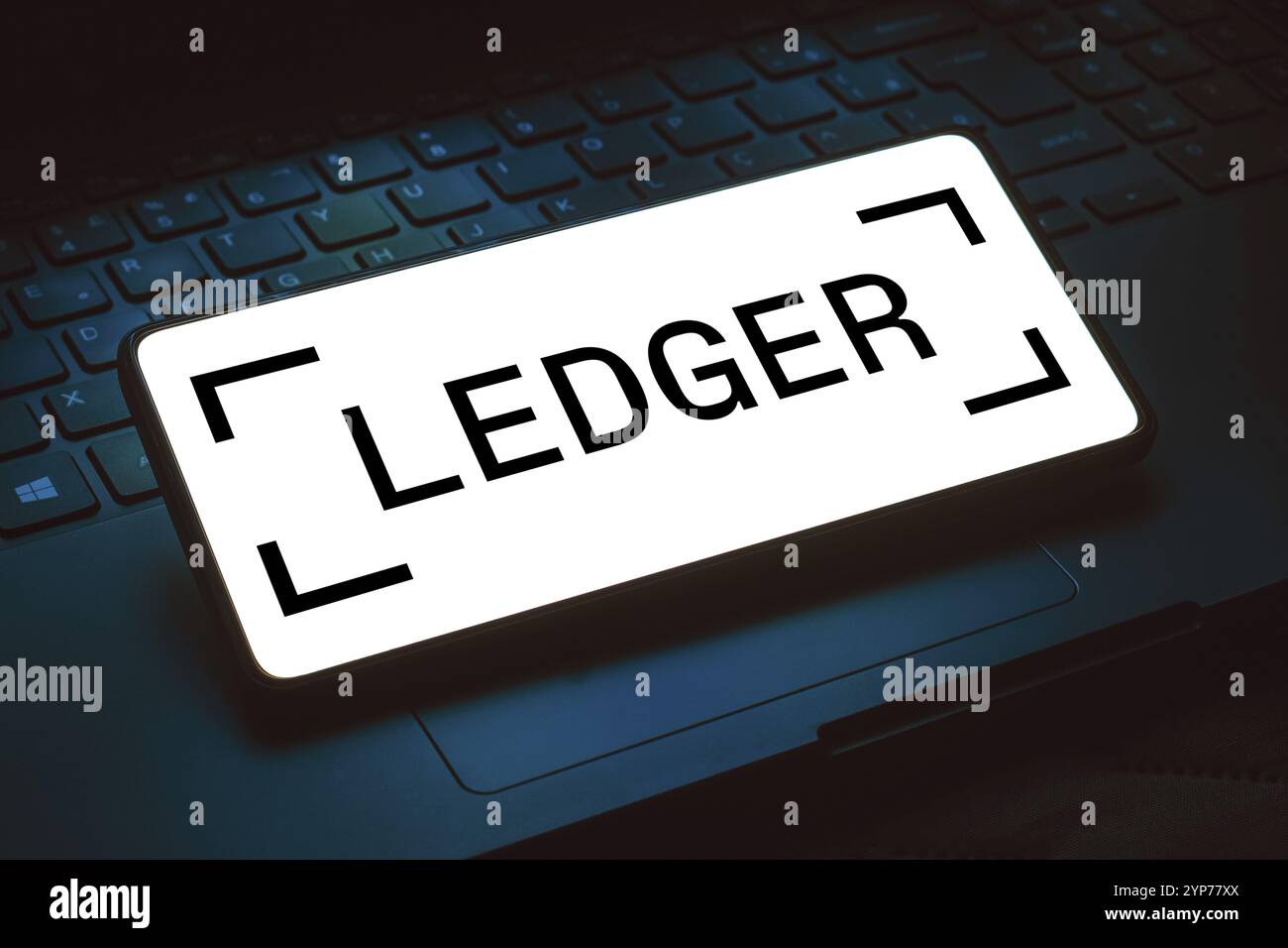 In this photo illustration, the Ledger logo is displayed on a ...