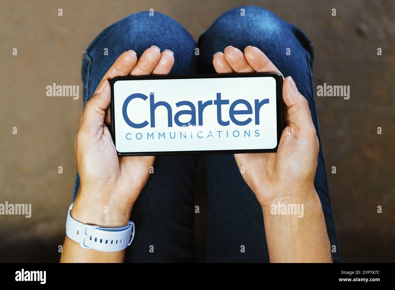 In this photo illustration, the Charter Communications logo is ...