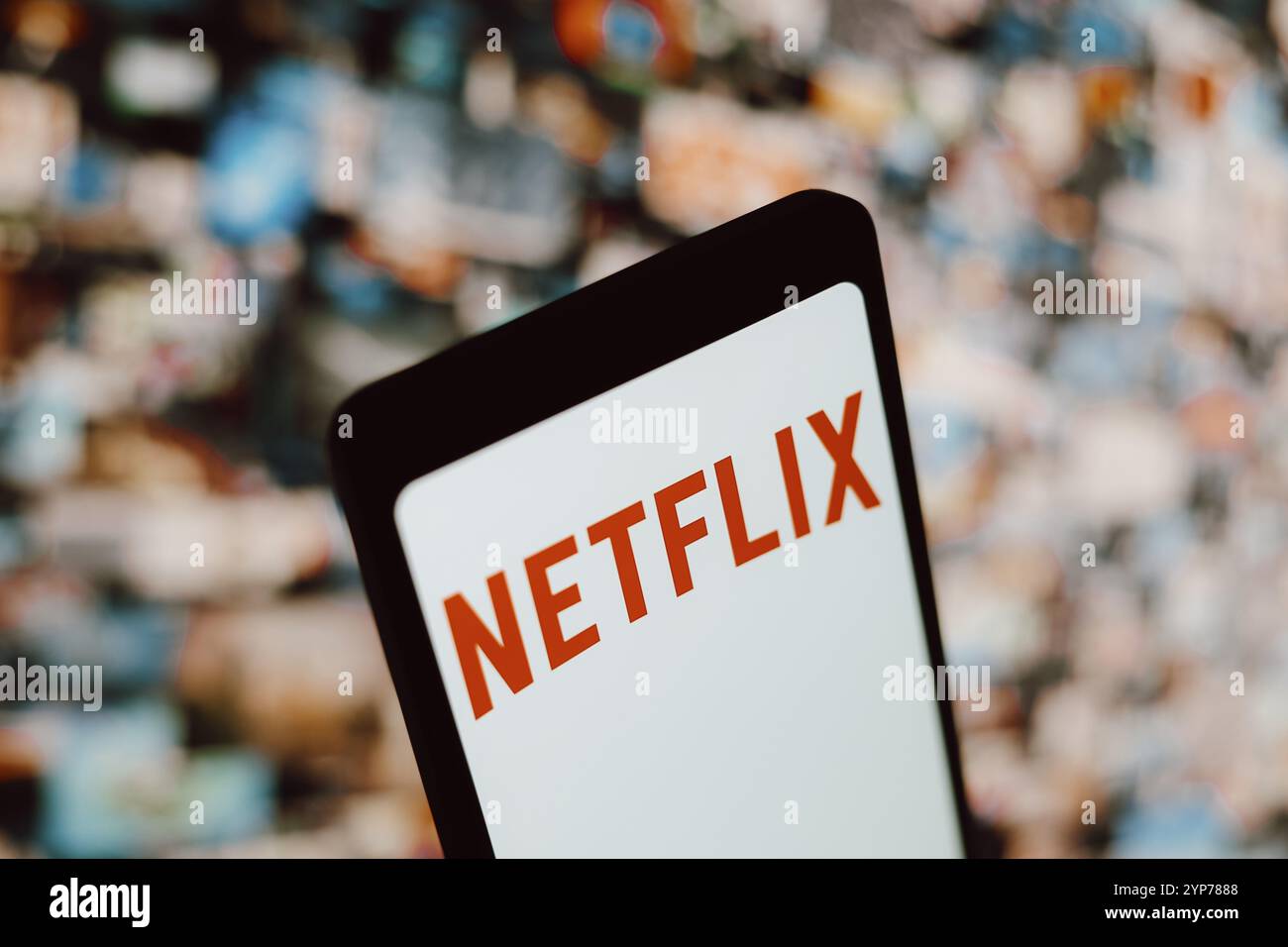 In this photo illustration, the Netflix logo is displayed on a ...