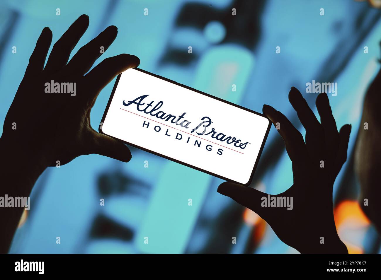 In this photo illustration, the Atlanta Braves Holdings logo is ...