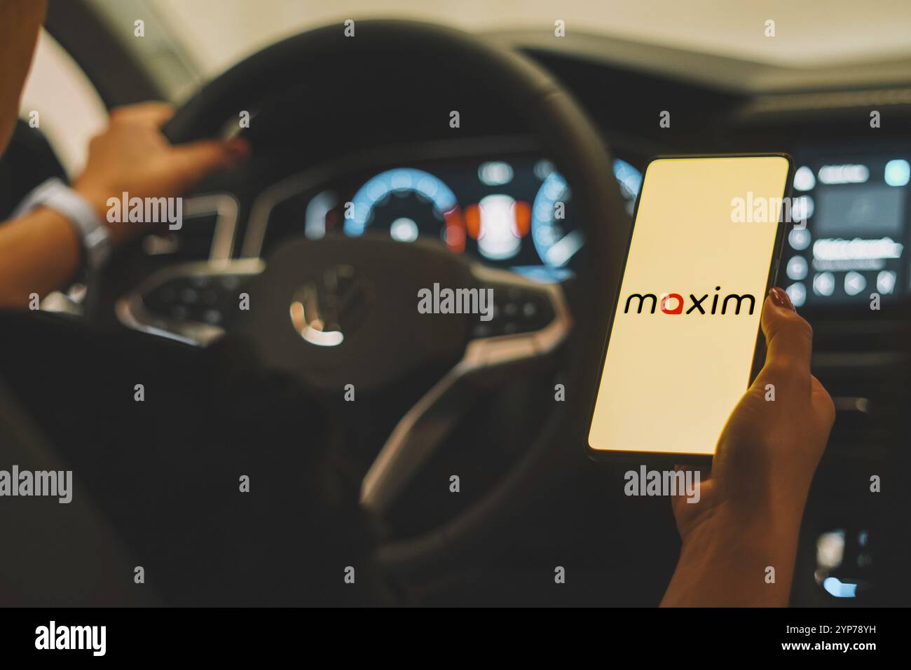 In this photo illustration, the Maxim logo is displayed on a smartphone ...