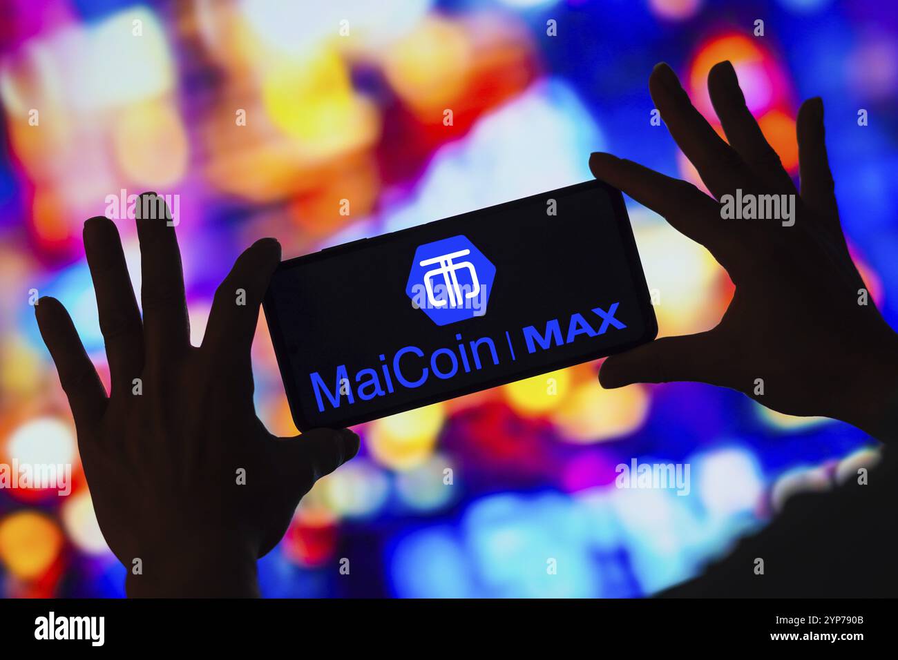 In this photo illustration, the MaiCoin MAX Exchange logo seen displayed on a smartphone Stock ...