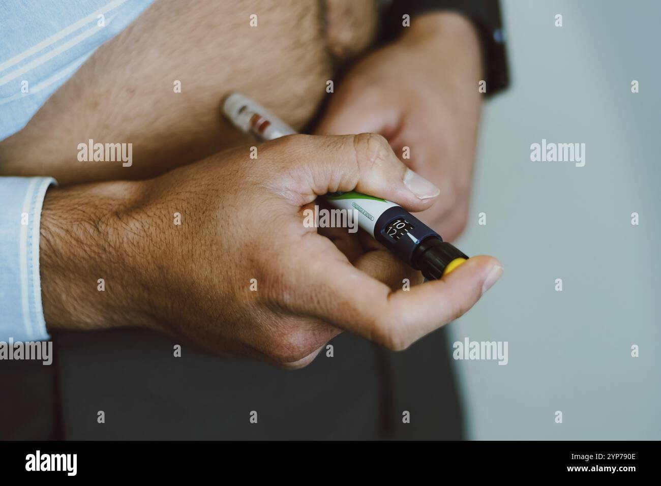 In this photo, a man injects human insulin into the body for blood ...