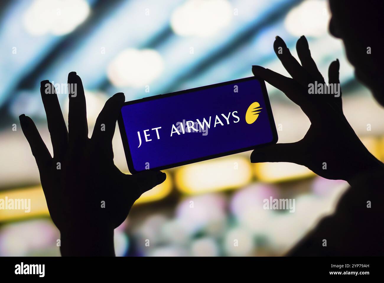 In this photo illustration, the Jet Airways logo is displayed on a ...