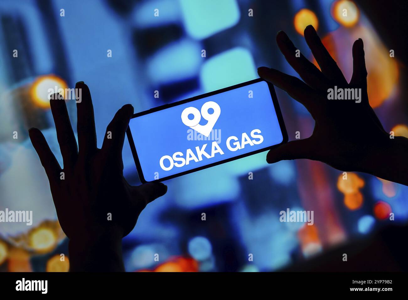 In this photo illustration, the Osaka Gas logo is seen displayed on a smartphone Stock Photo - Alamy