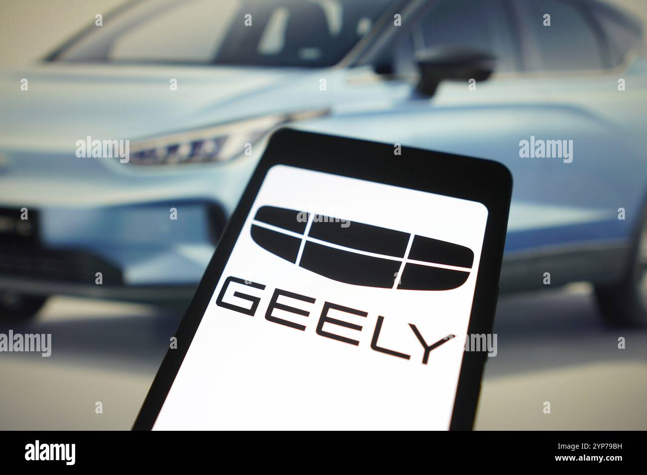 In this photo illustration, the Geely Automobile logo is displayed on a ...
