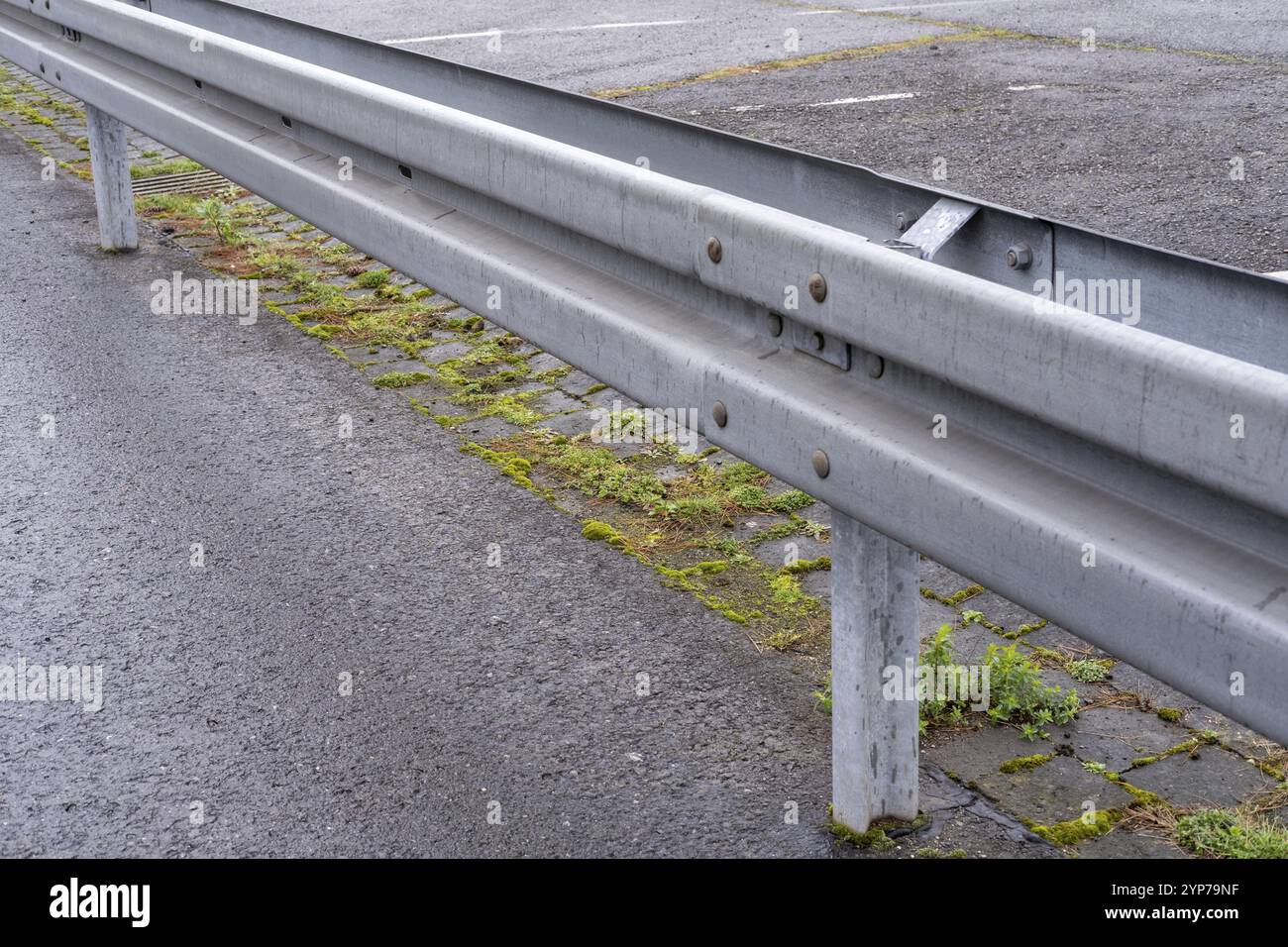 Guardrail divides the road Stock Photo - Alamy