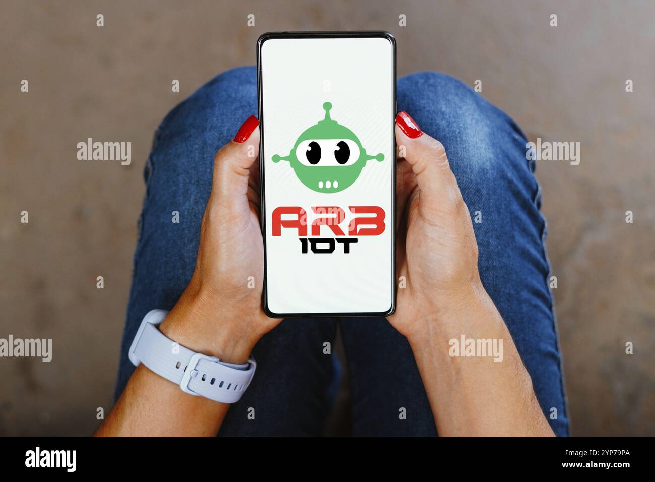 In this photo illustration, the ARB IOT Group Limited logo is displayed ...