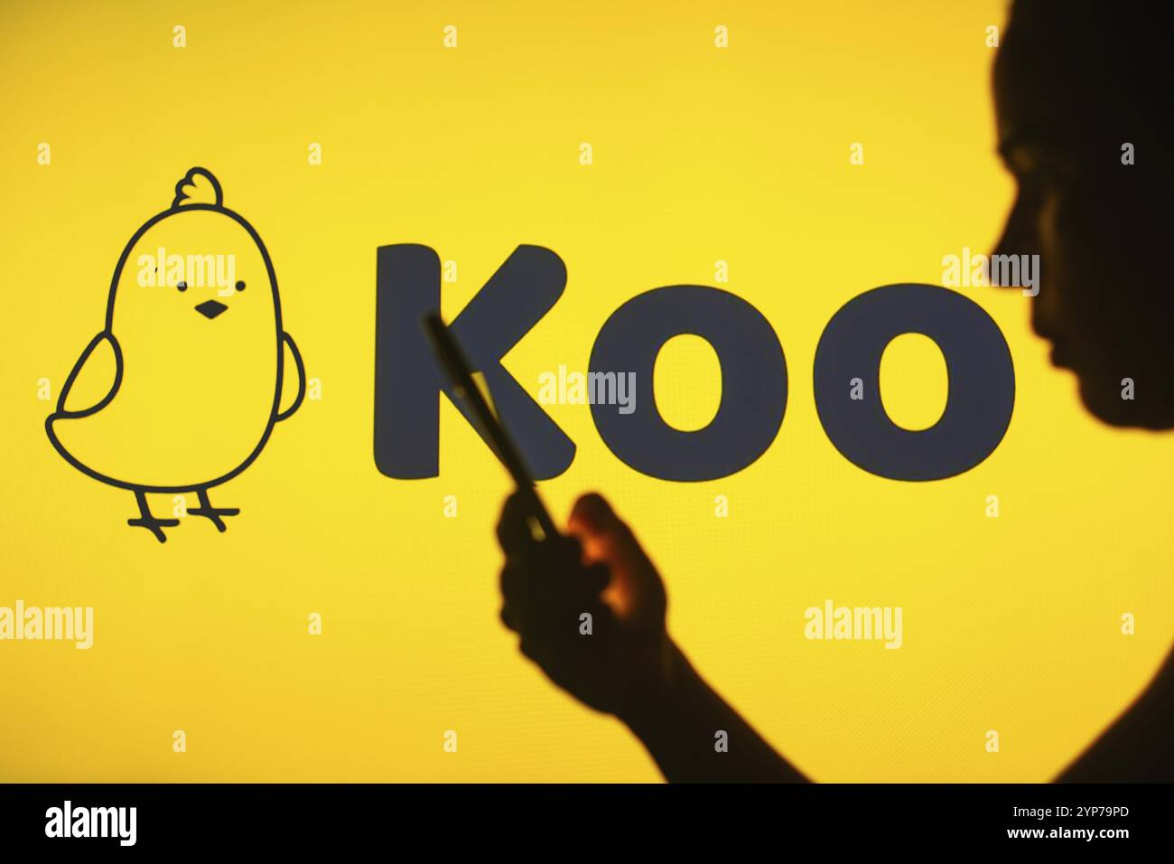 In this photo illustration, a woman's silhouette holds a smartphone ...