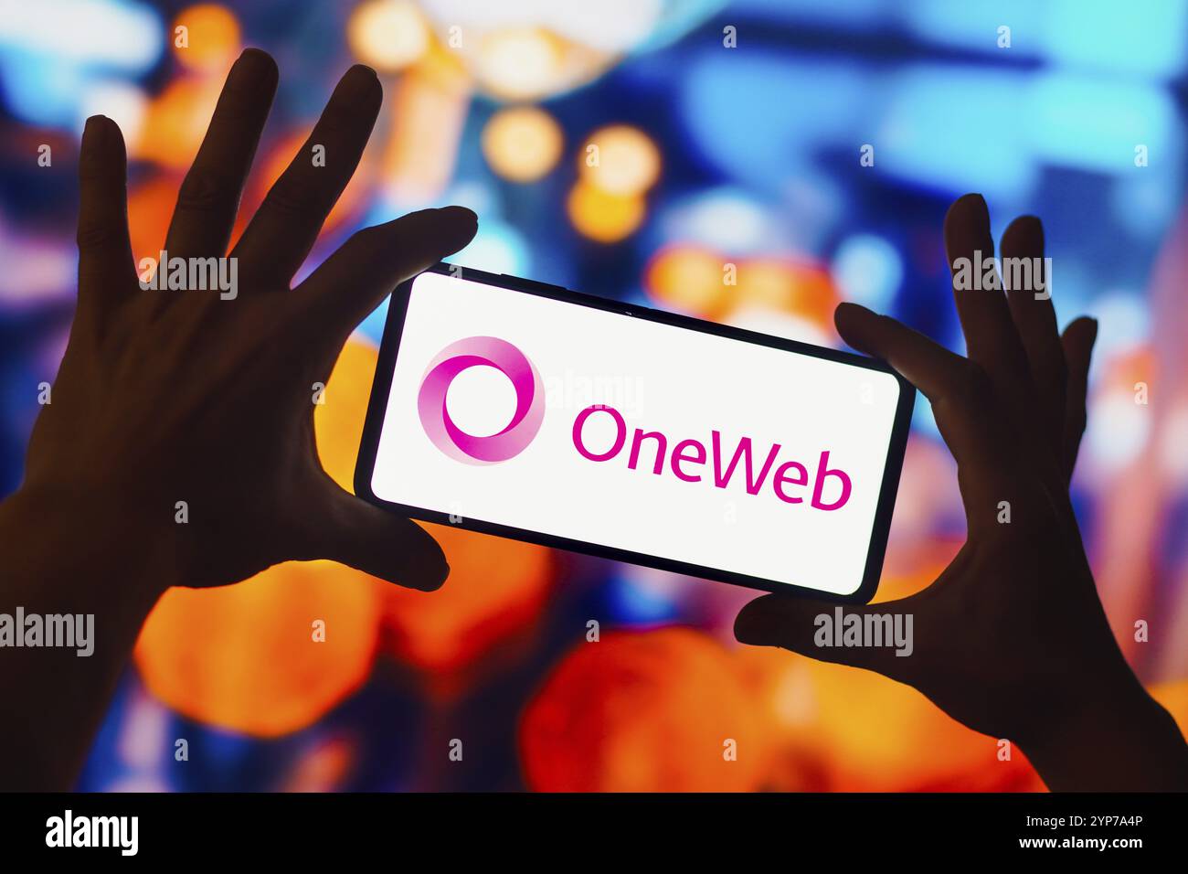 In this photo illustration, the OneWeb logo is displayed on a ...