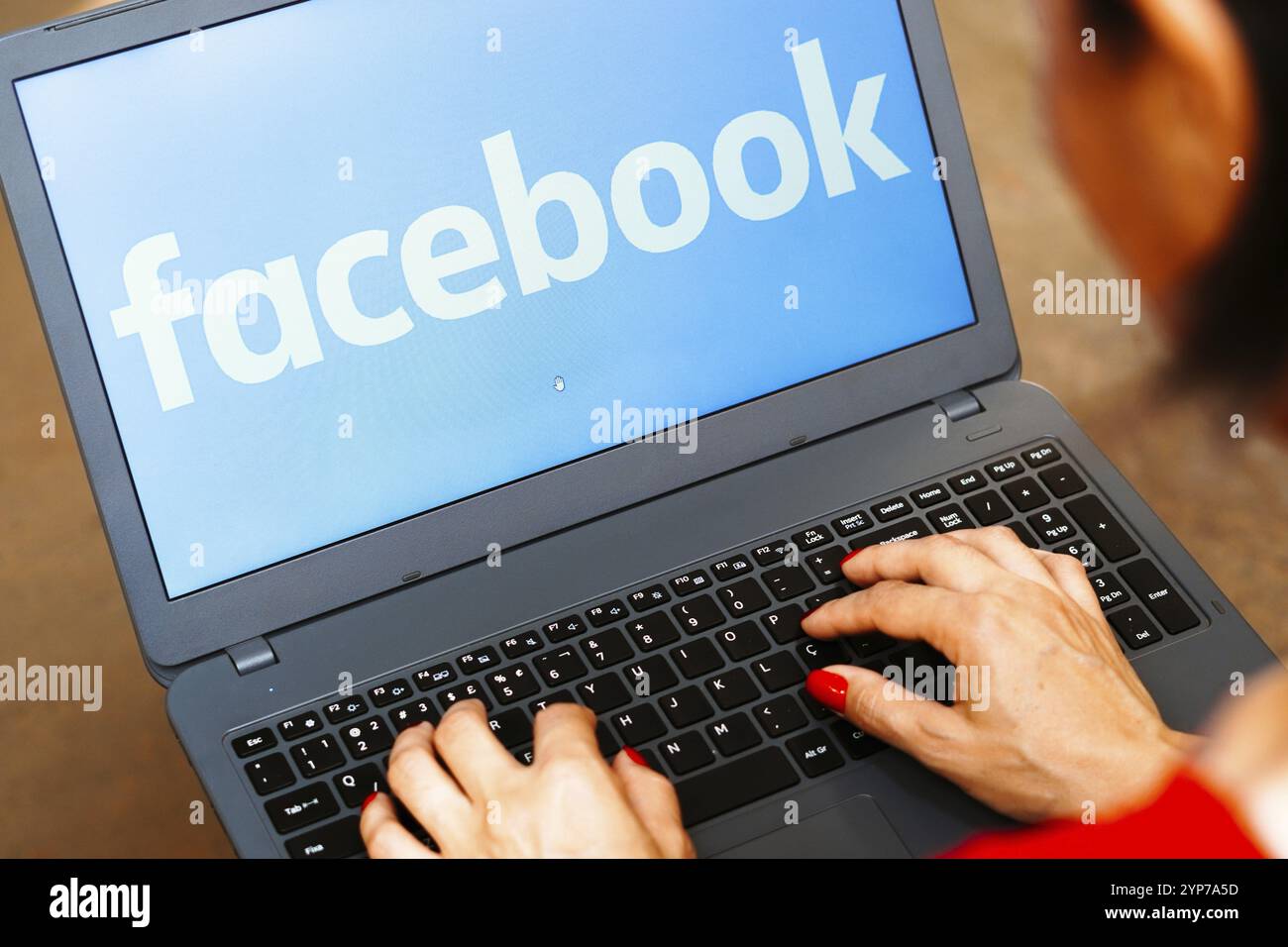In this photo illustration, the Facebook logo is displayed on a ...