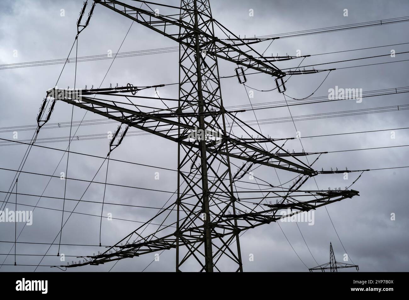 Large electricity pylons in detail under stormy skies Stock Photo - Alamy