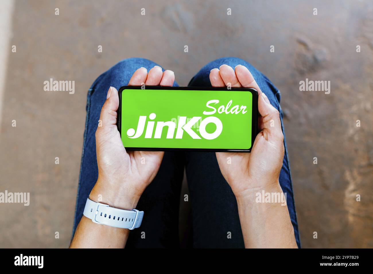 In this photo illustration, the Jinko Solar logo is displayed on a ...