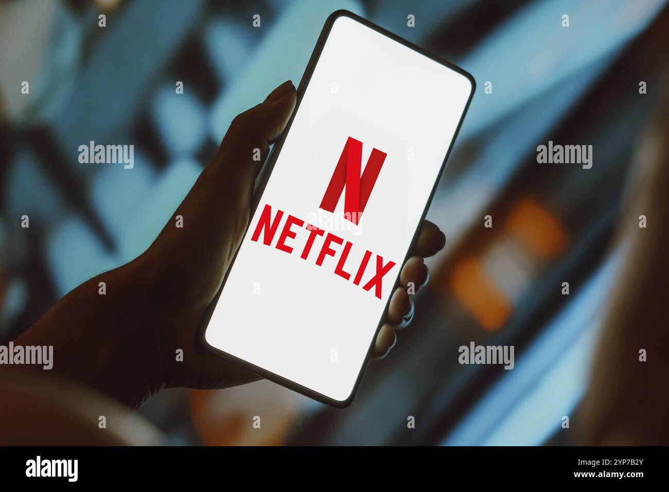 In this photo illustration, the Netflix logo is displayed on a ...