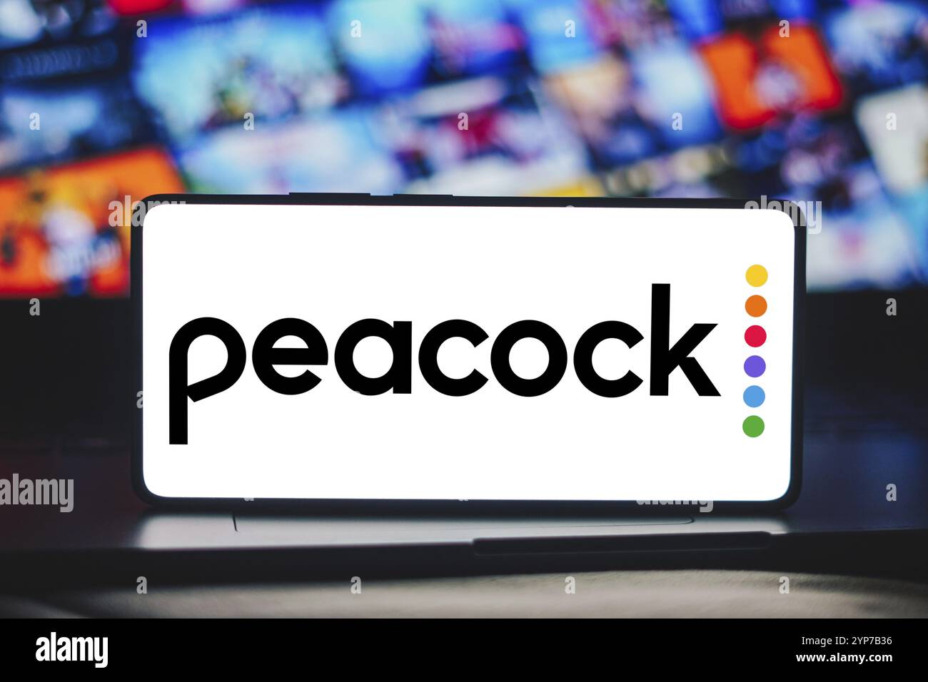 In this photo illustration, the Peacock logo is displayed on a ...