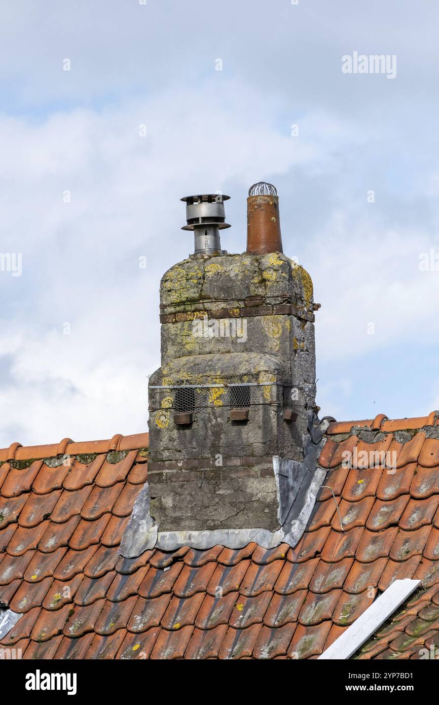 Chimney on a roof with clay tiles Stock Photo - Alamy