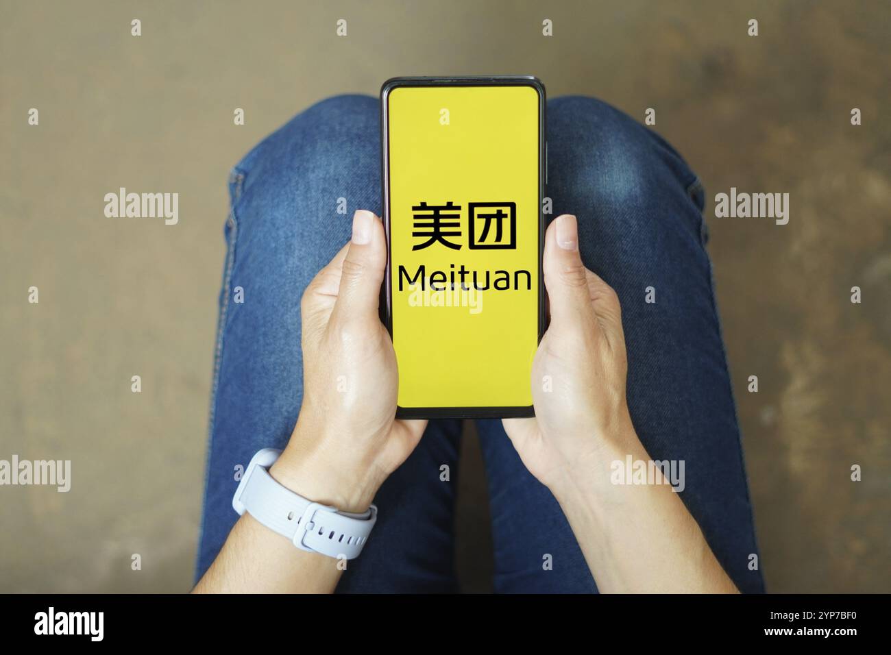In this photo illustration, the Meituan logo seen displayed on a ...