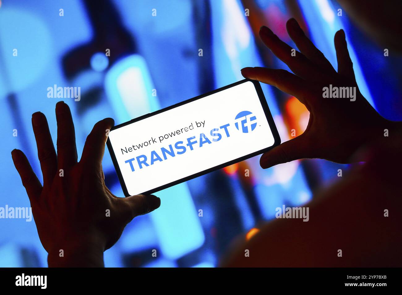 In this photo illustration, the Transfast logo is displayed on a ...