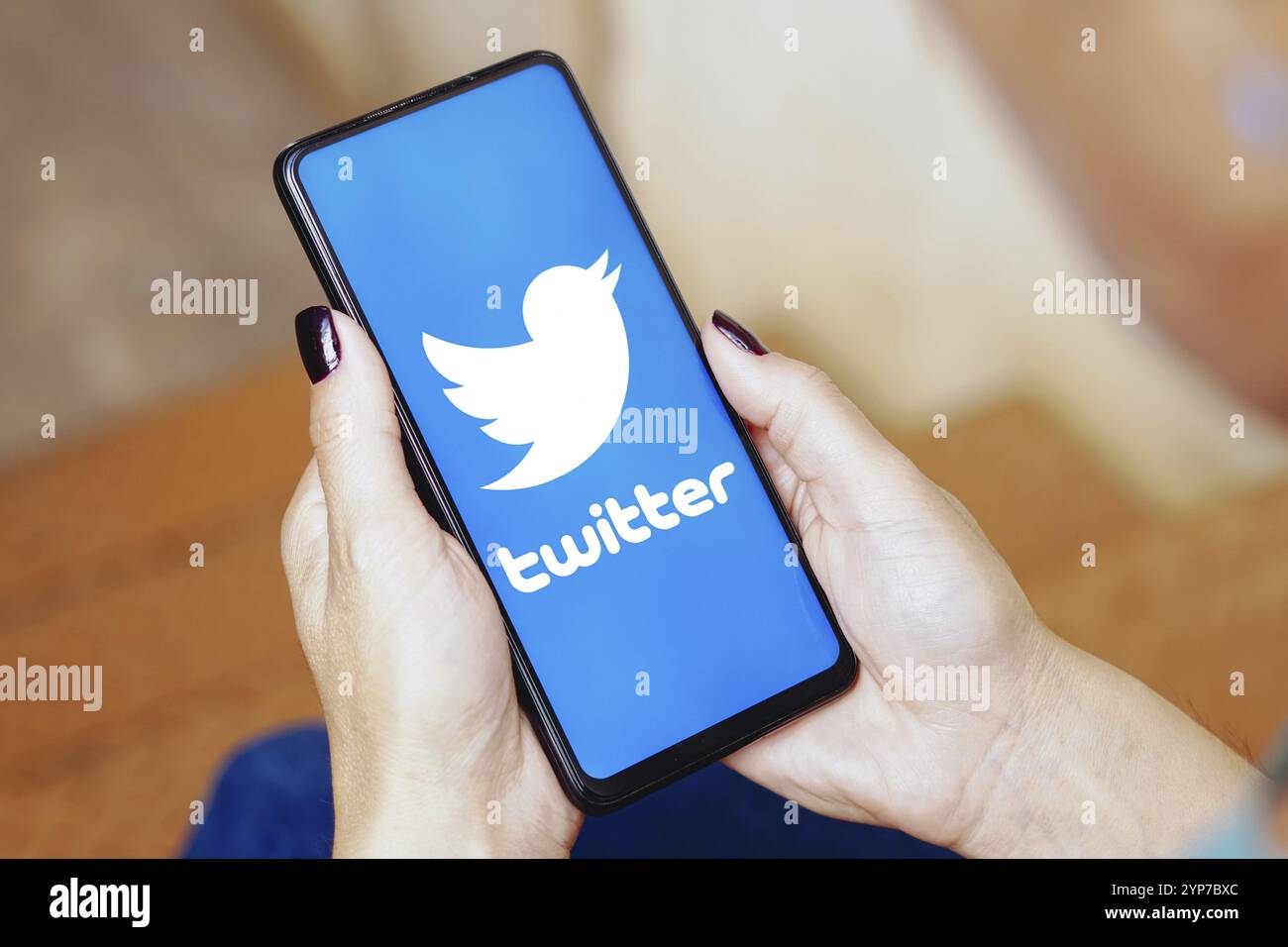 In this photo illustration, the Twitter logo is displayed on a ...