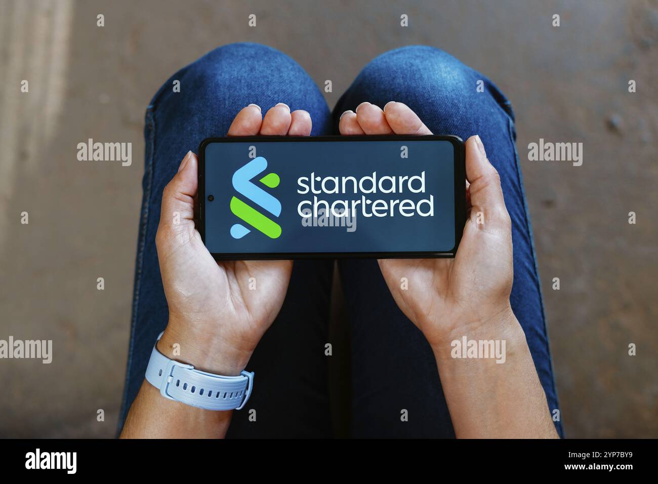 In this photo illustration, the Standard Chartered logo is displayed on ...
