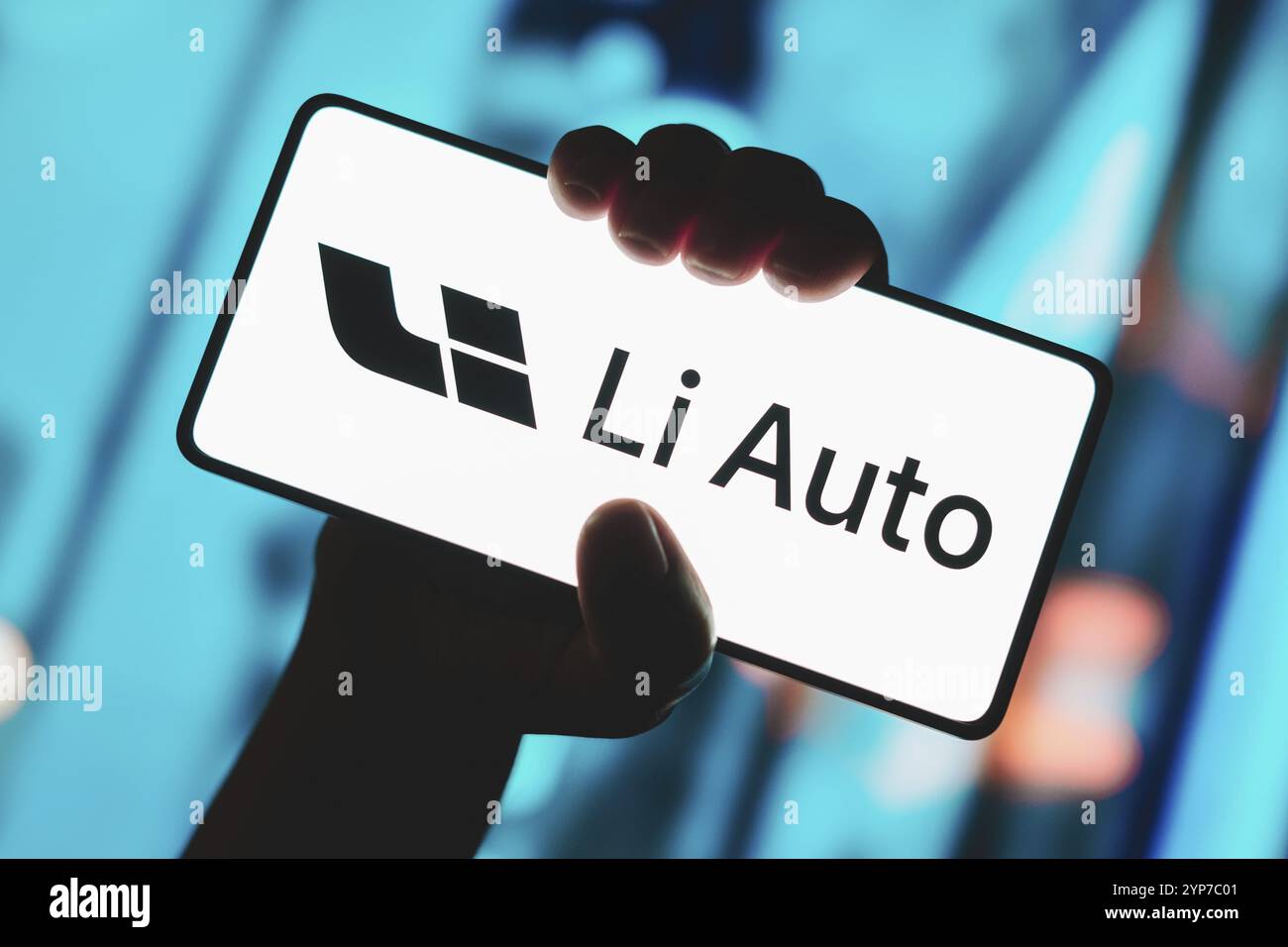 In this photo illustration, the Li Auto logo is displayed on a ...