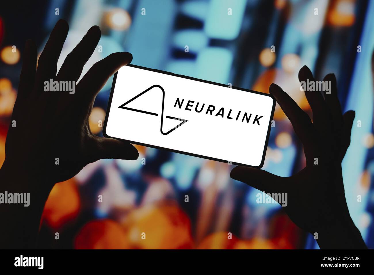 In this photo illustration, the Neuralink logo is displayed on a ...