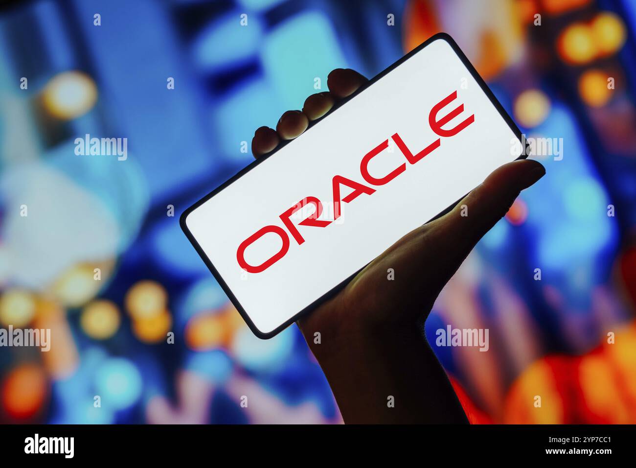 In this photo illustration, the Oracle logo is displayed on a ...