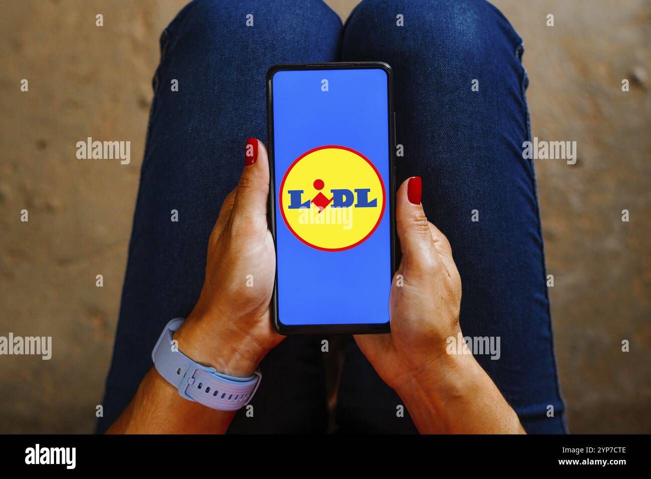 In this photo illustration, the Lidl logo is displayed on a smartphone ...