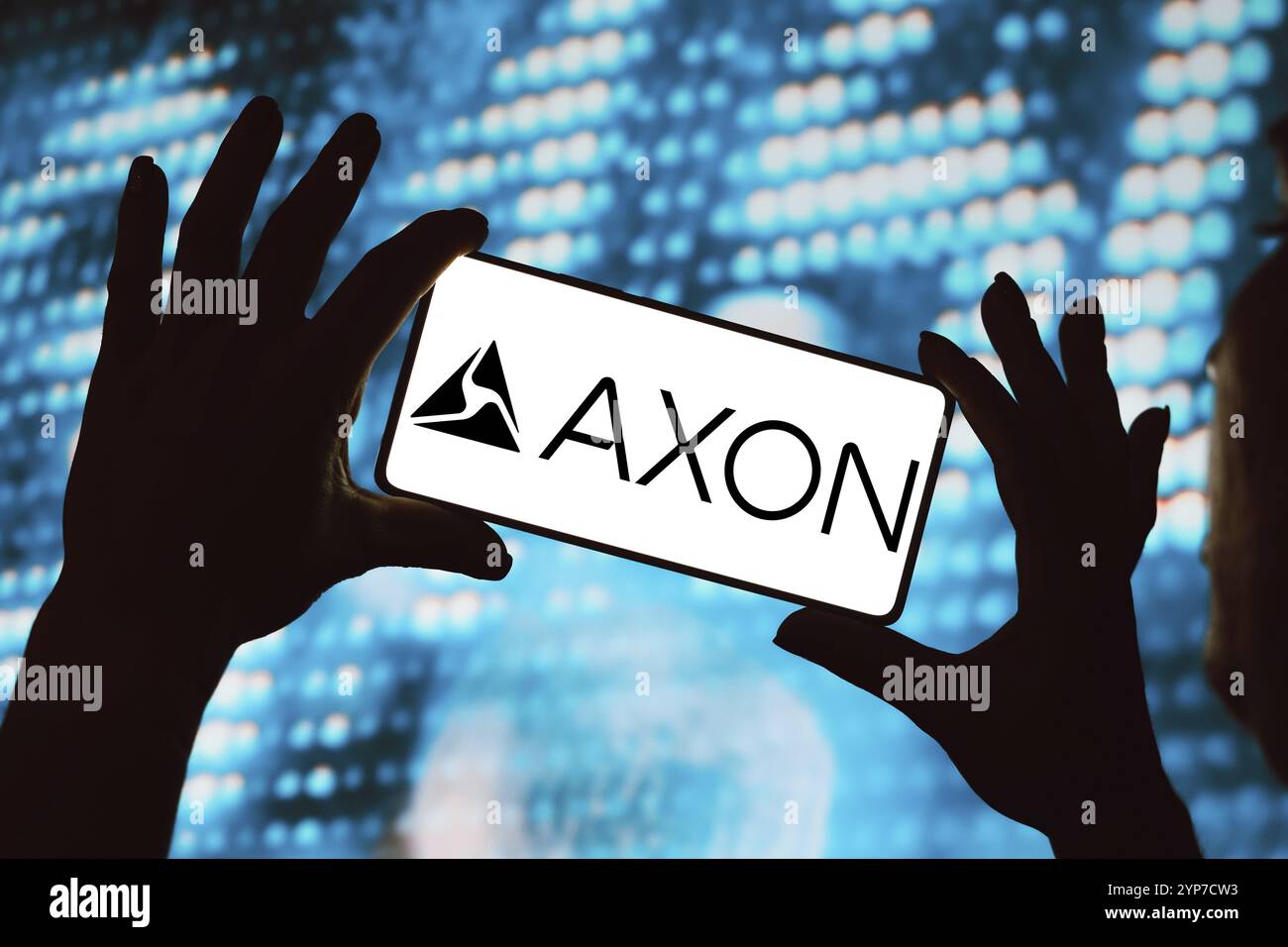 In this photo illustration, the Axon Enterprise logo is displayed on a ...