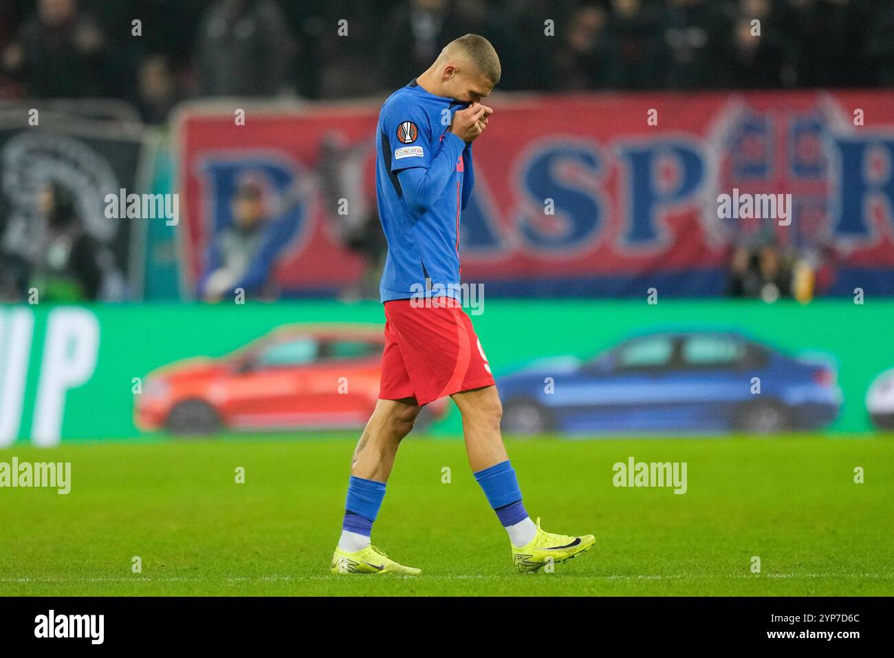 FCSB's Daniel Birligea leaves the pitch after seeing the red card ...