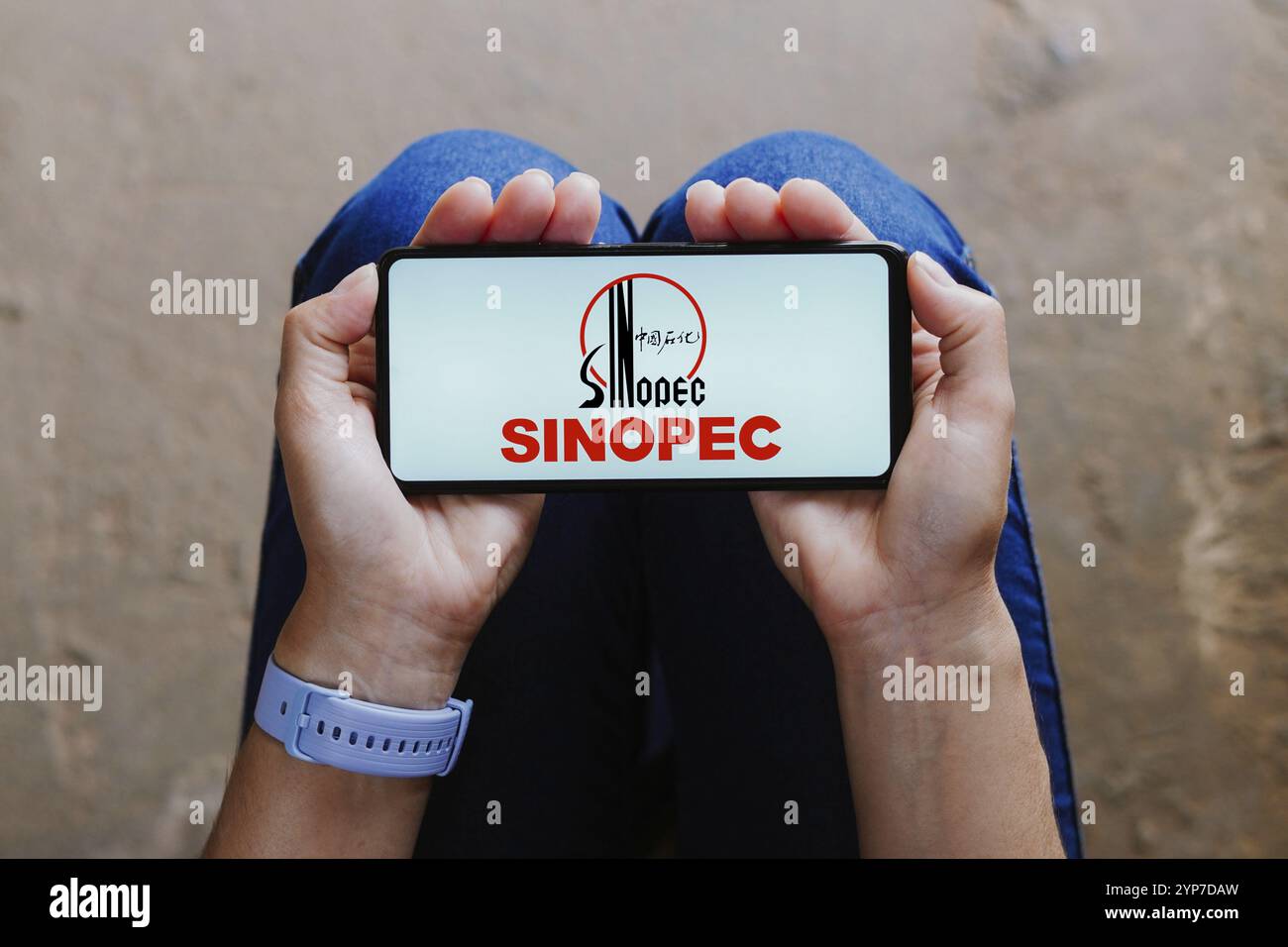 In this photo illustration, the Sinopec logo seen displayed on a ...