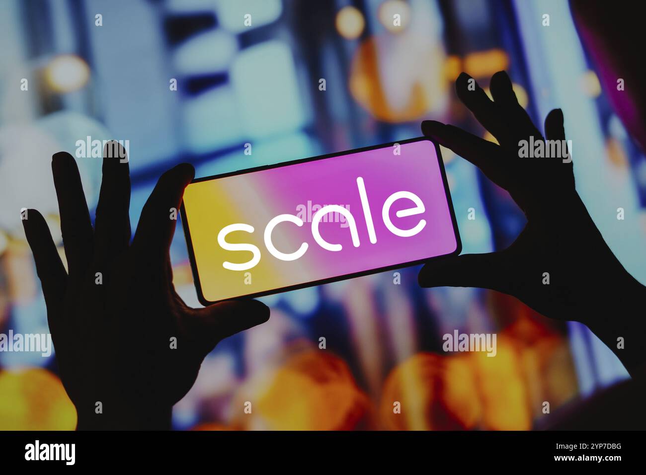 In this photo illustration, the Scale AI logo is displayed on a ...