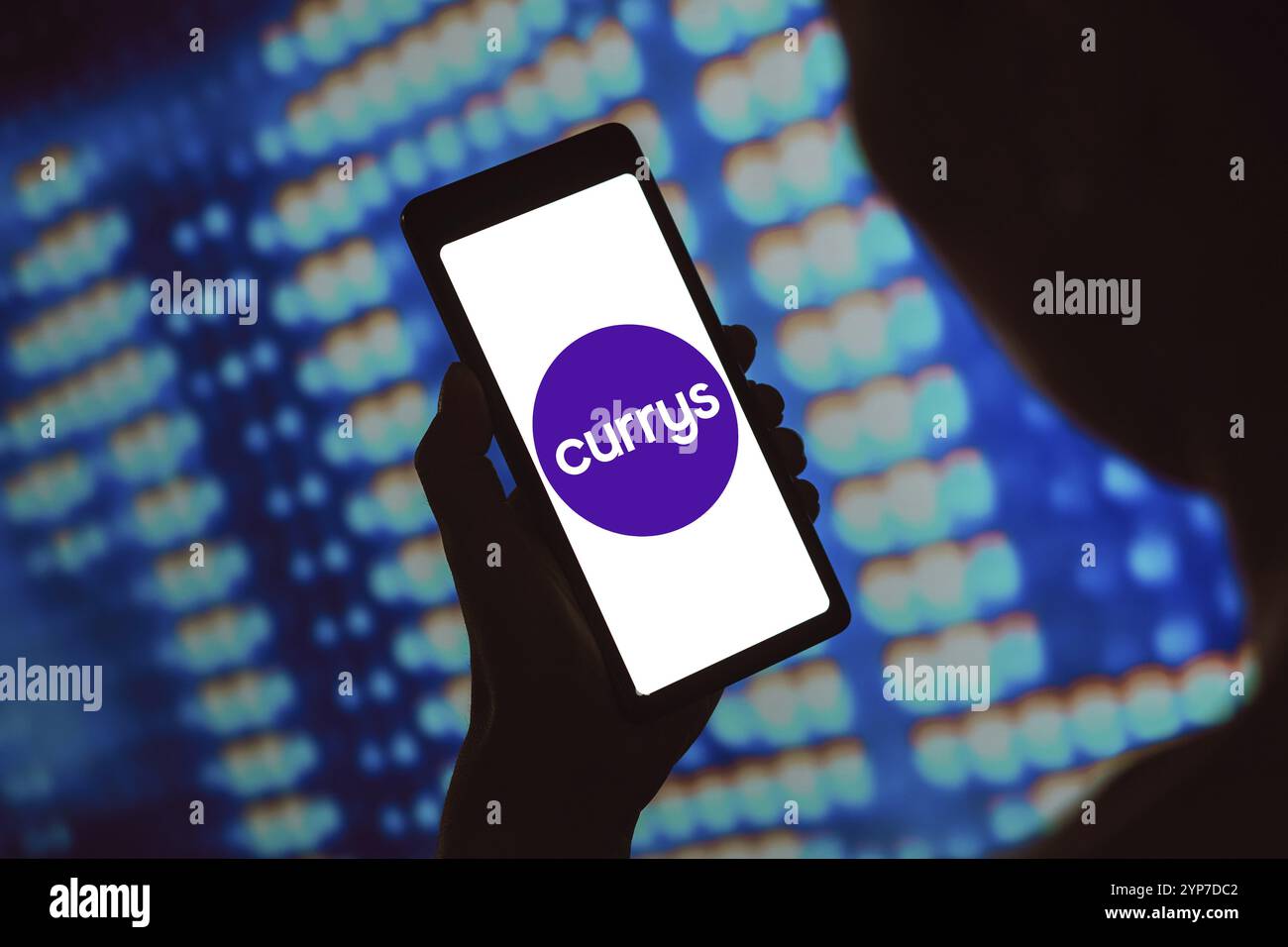 In this photo illustration, the Currys logo is displayed on a ...