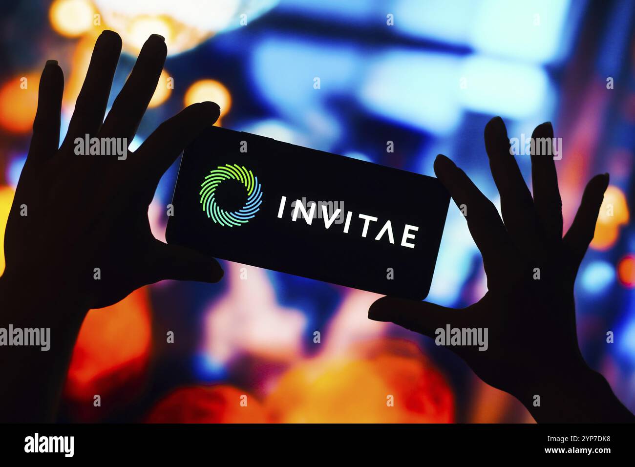 In this photo illustration, the Invitae logo is displayed on a ...
