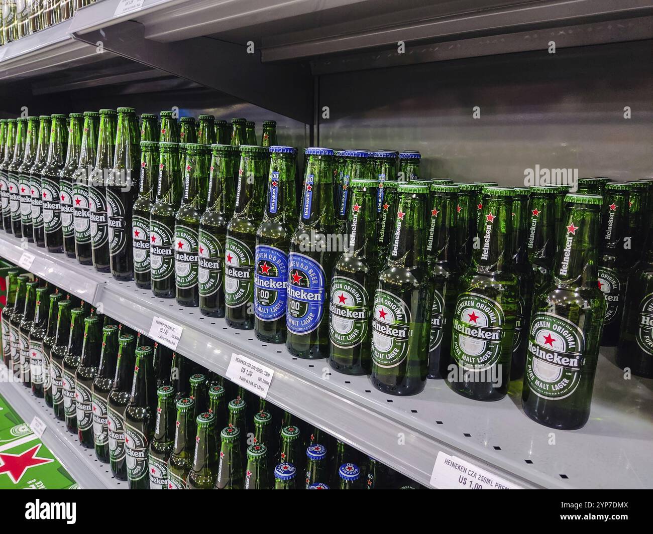 Bottles of Heineken beer on a supermarket shelf in Pedro Juan Caballero ...