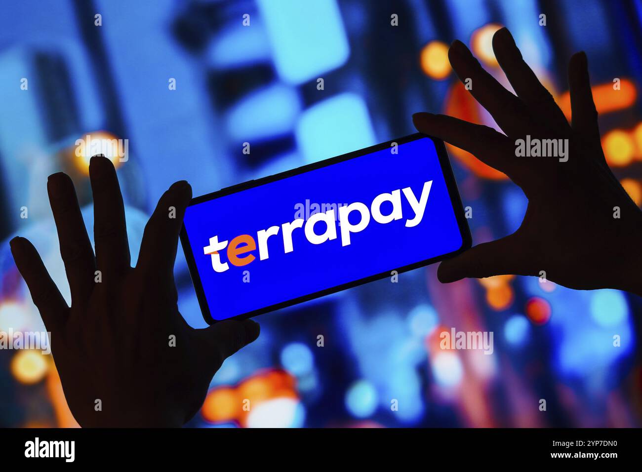 In this photo illustration, the TerraPay logo is displayed on a smartphone screen Stock Photo ...