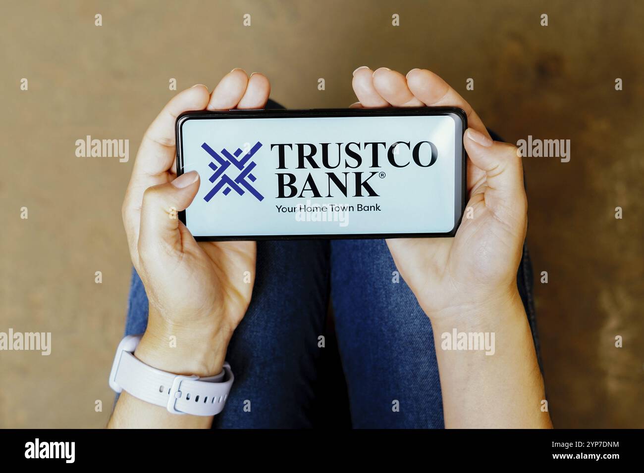 In this photo illustration, the Trustco Bank logo seen displayed on a ...