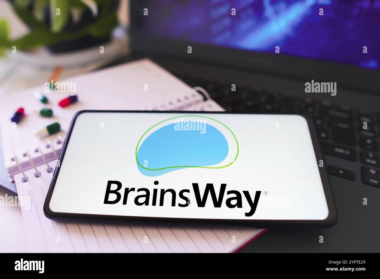 In this photo illustration, the BrainsWay logo is displayed on a ...