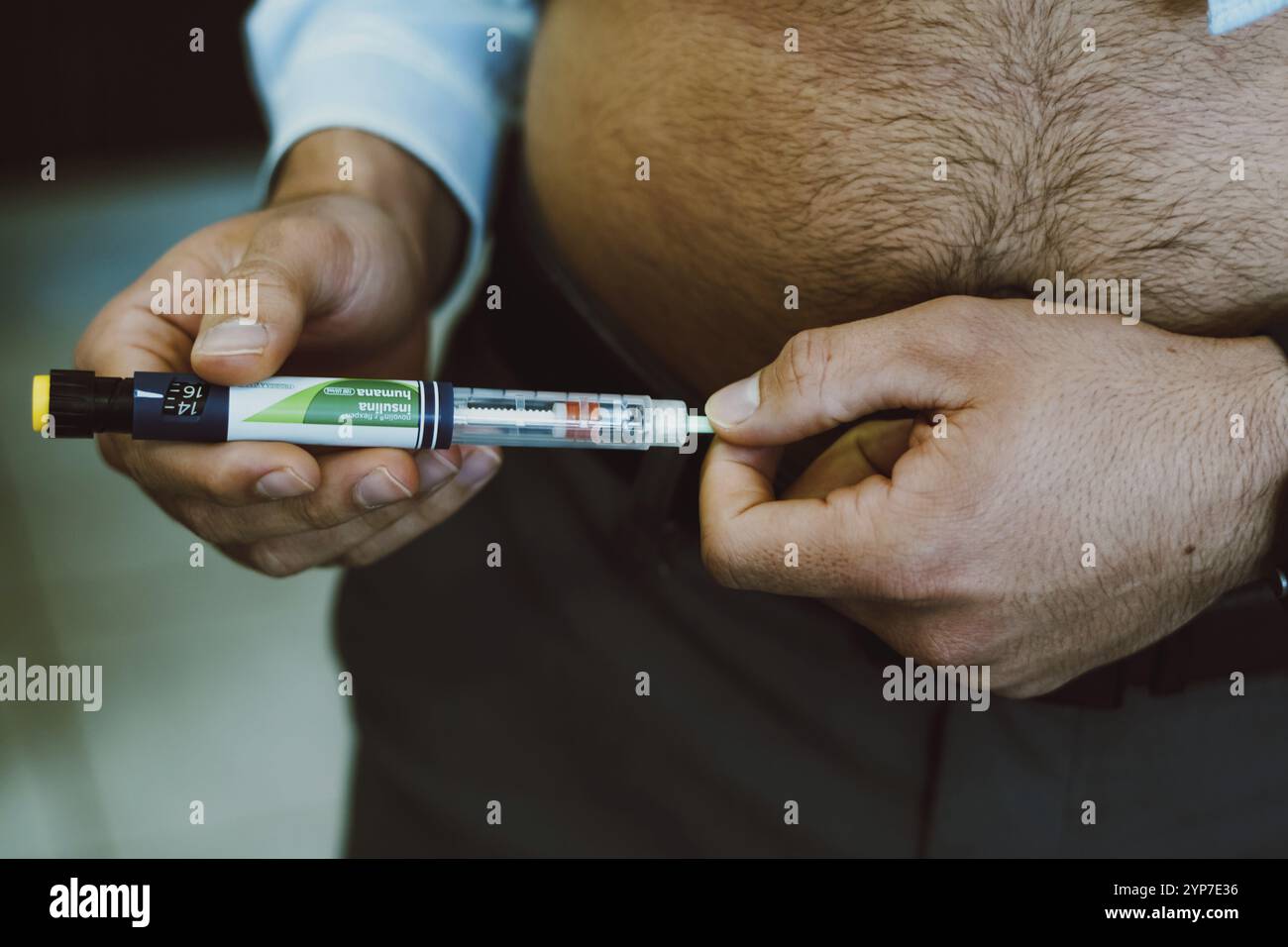 In this photo, a man injects human insulin into the body for blood ...