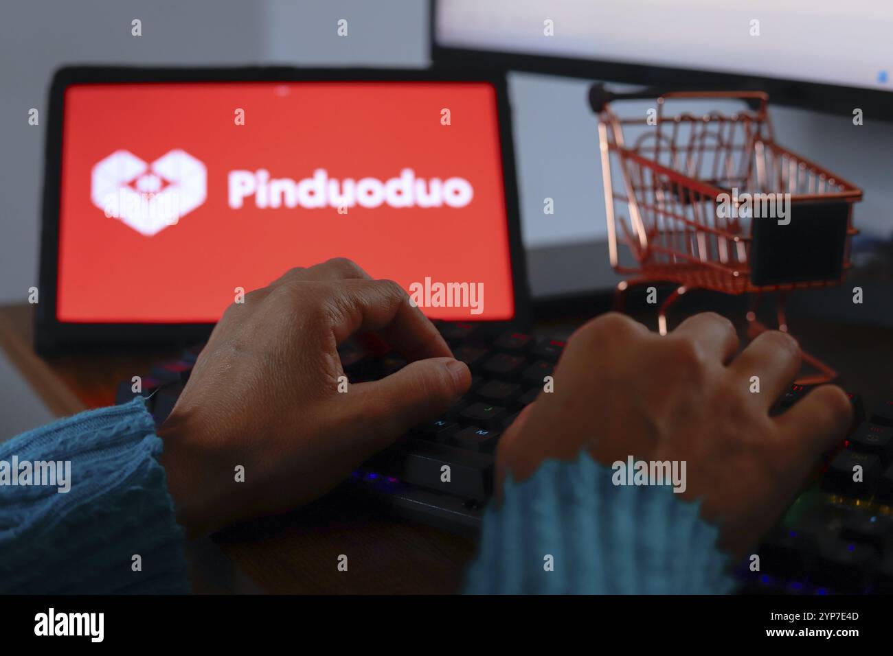 In this photo illustration, a person typing and in the background the ...