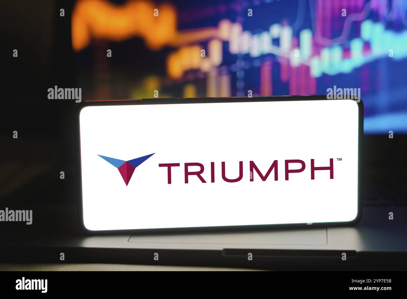 In this photo illustration, the Triumph Group logo is displayed on a ...